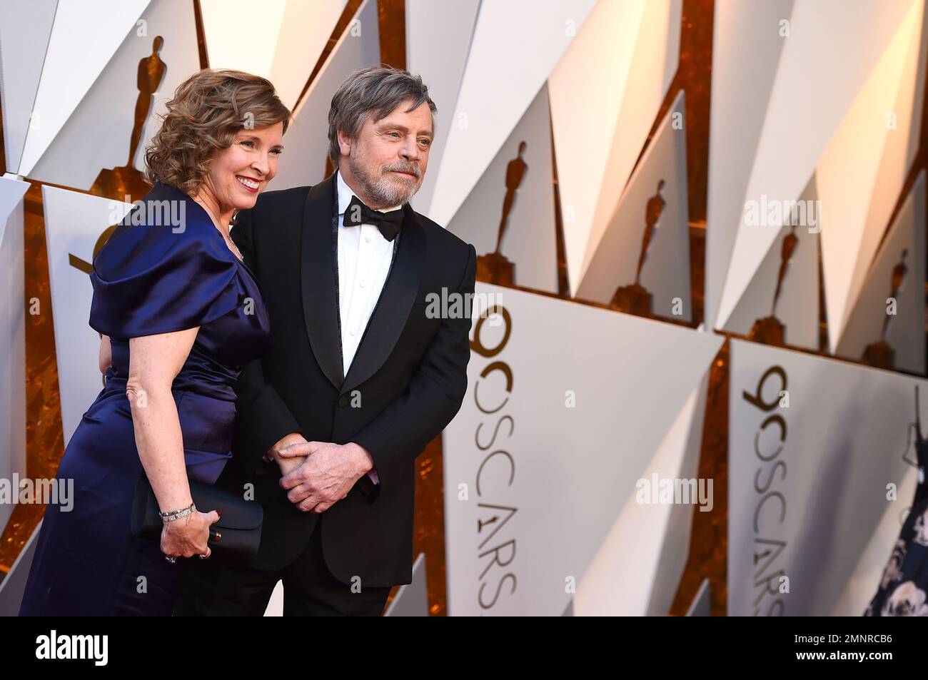 Marilou York, left, and Mark Hamill arrive at the Oscars on Sunday ...