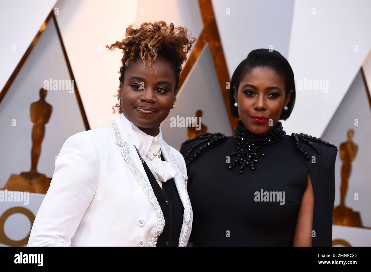 Dee Rees, left, and Sarah M. Broom arrive at the Oscars on Sunday ...