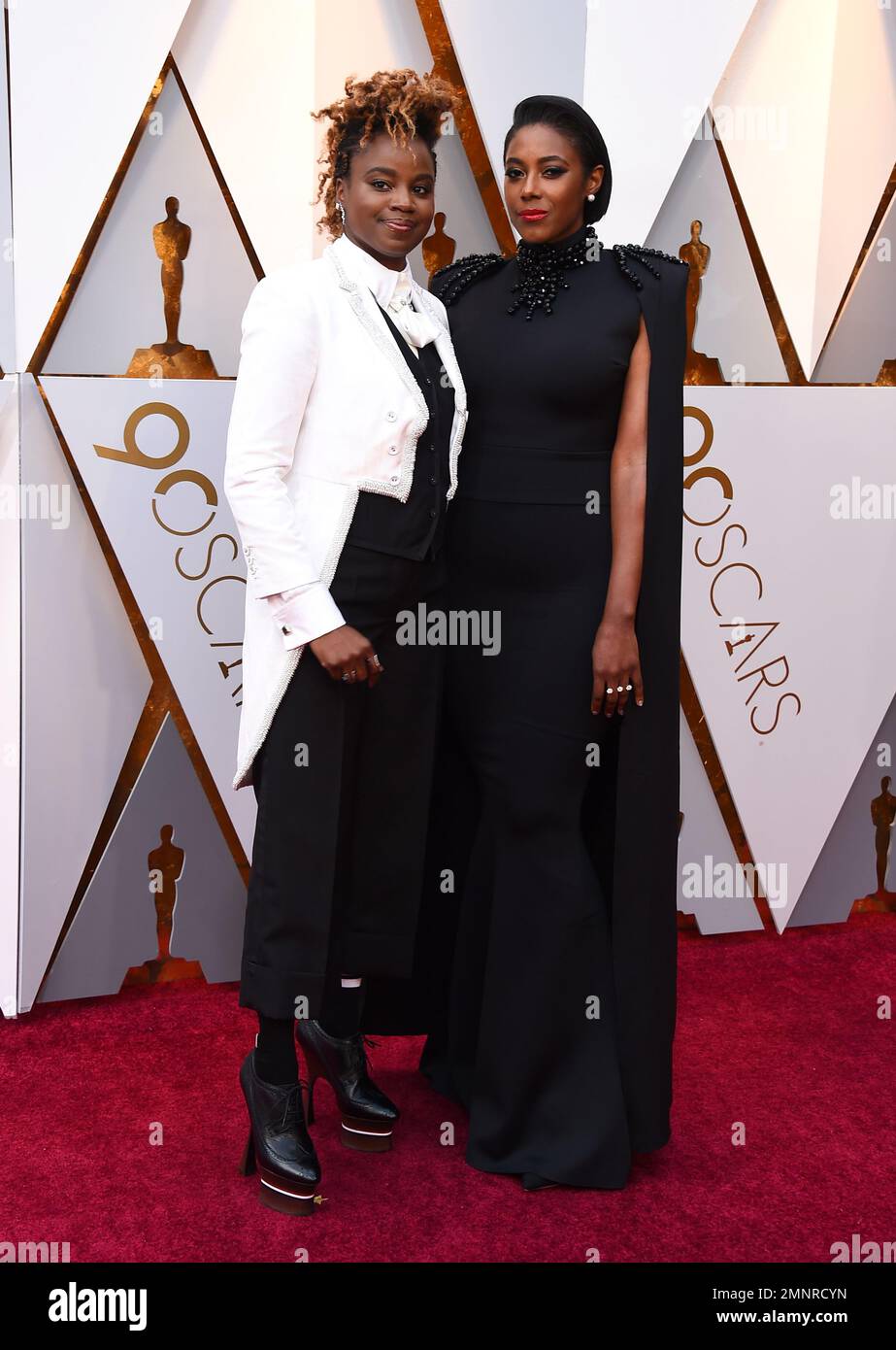 Dee Rees, left, and Sarah M. Broom arrive at the Oscars on Sunday ...