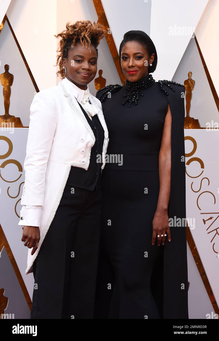 Dee Rees, left, and Sarah M. Broom arrive at the Oscars on Sunday ...