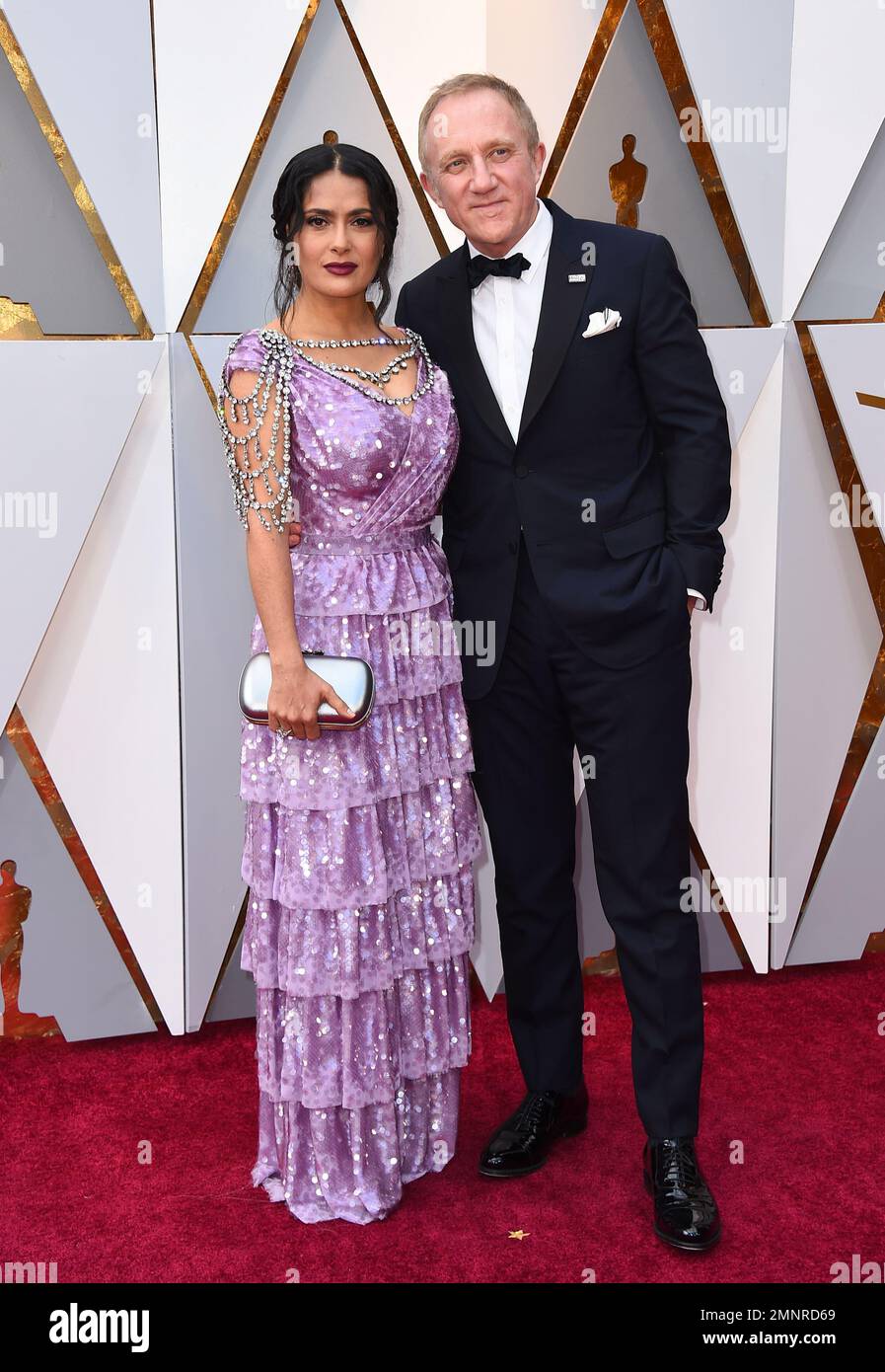Salma Hayek, left, and Francois-Henri Pinault arrive at the Oscars on ...