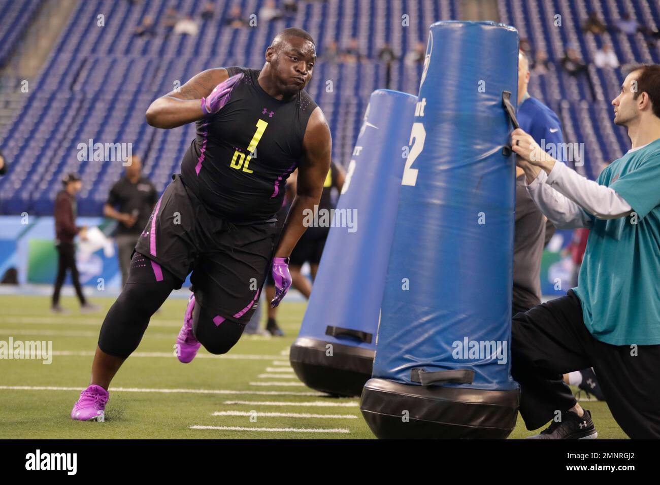 Georgia defensive lineman John Atkins runs a drill at the NFL football ...