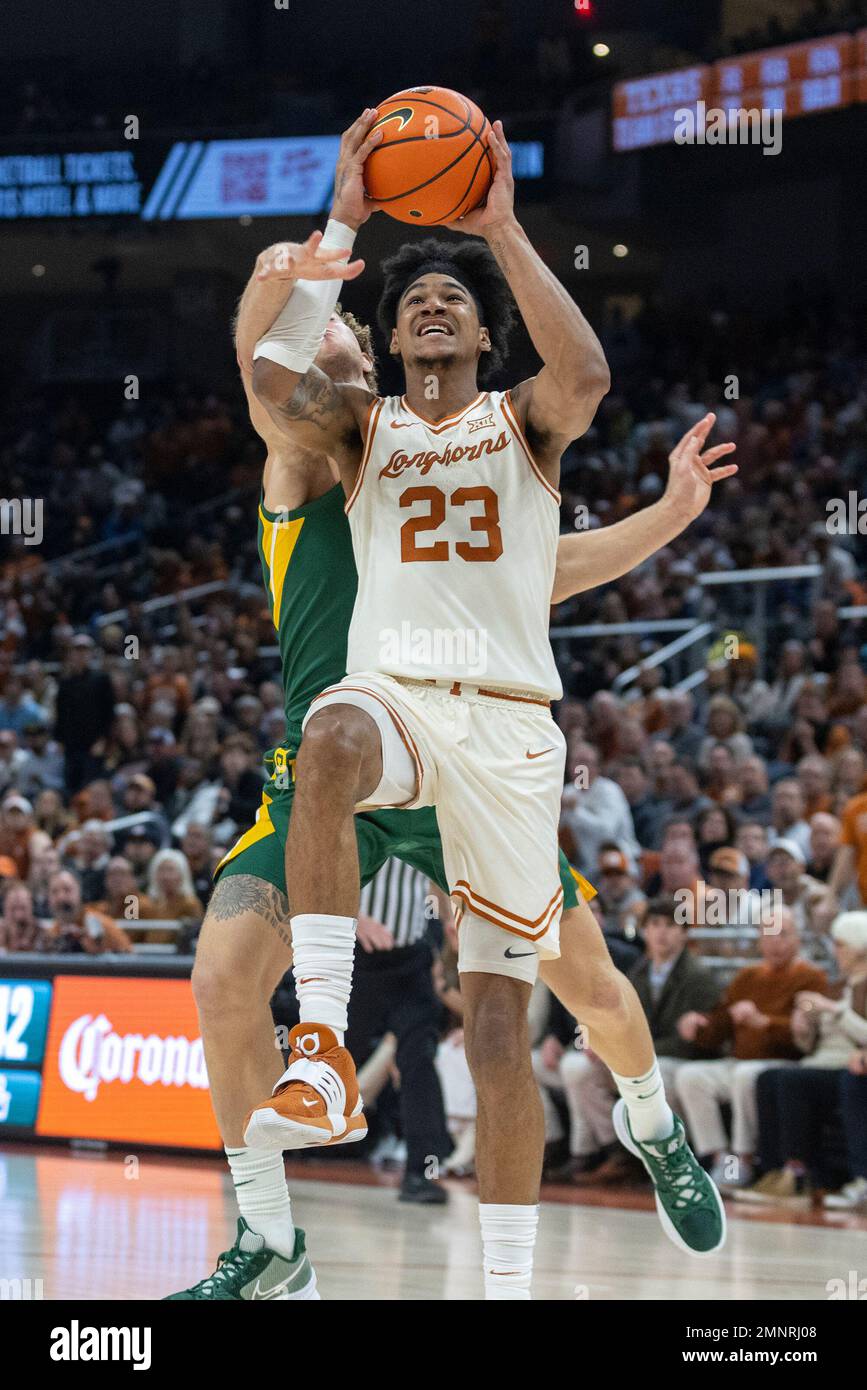 Texas forward Dillon Mitchell (23) goes to the basket past Baylor ...
