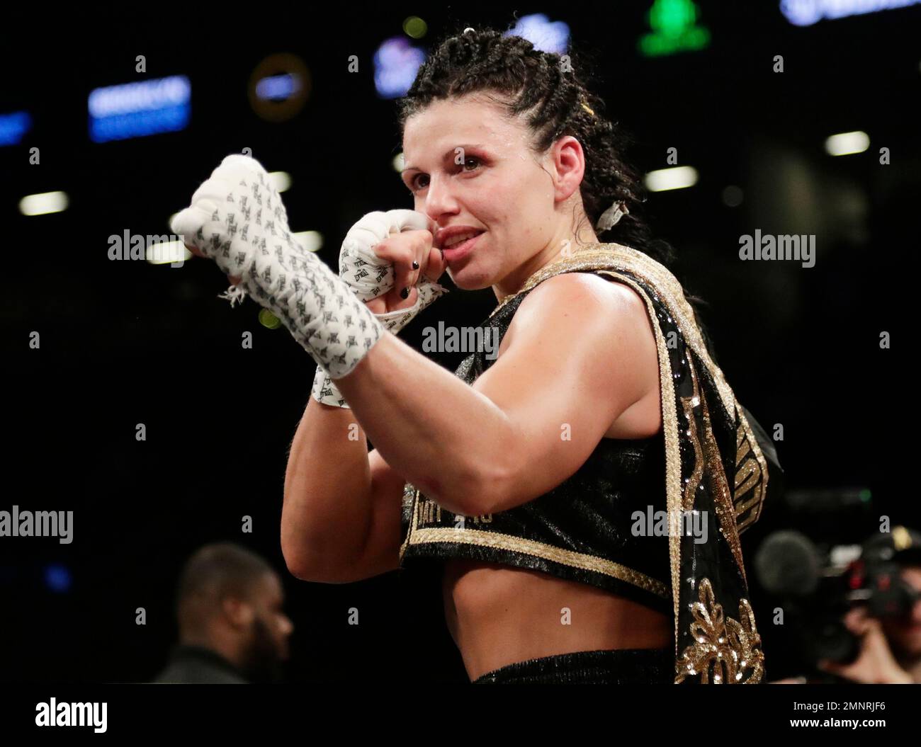 Alicia Napoleon poses for photographs after fighting Belgium's Femke ...