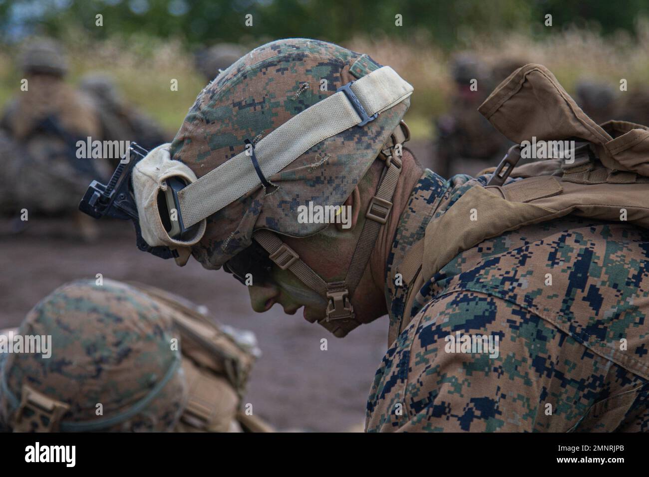 U.S. Marine Corps Cpl. Byron Work, a machine gunner with 3d Battalion ...