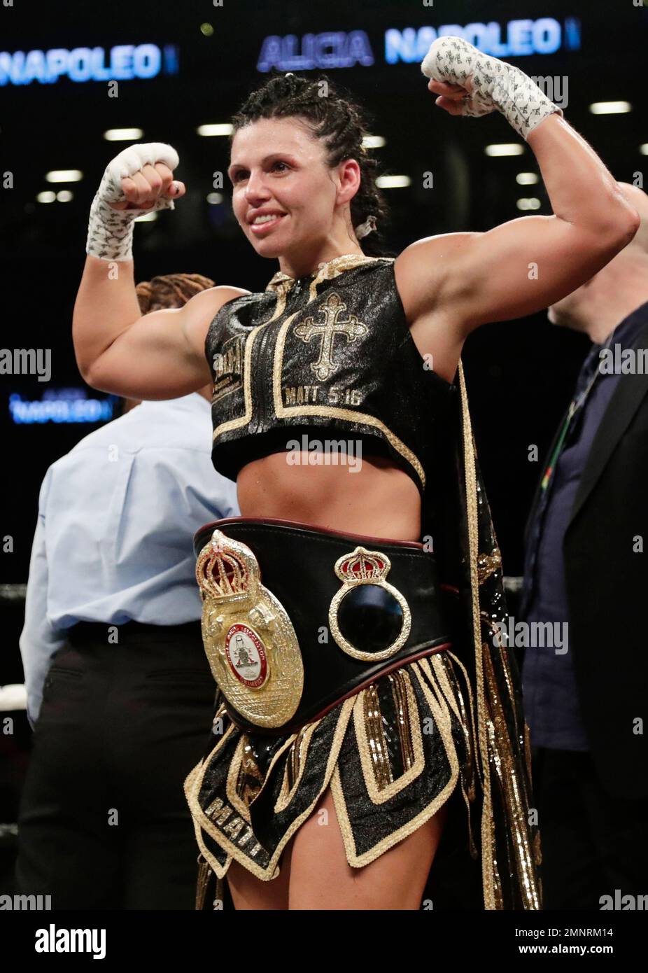 Alicia Napoleon poses for photographs with the championship belt after ...