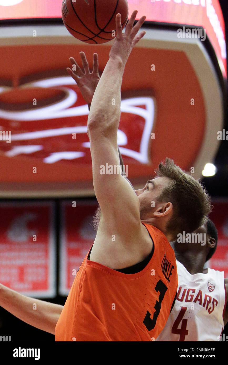 Oregon State forward Tres Tinkle (3) shoots next to Washington State ...