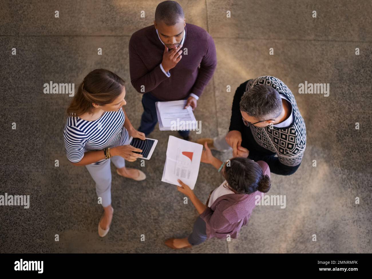 Stuff happens when we work together. High angle shot of a group of work ...