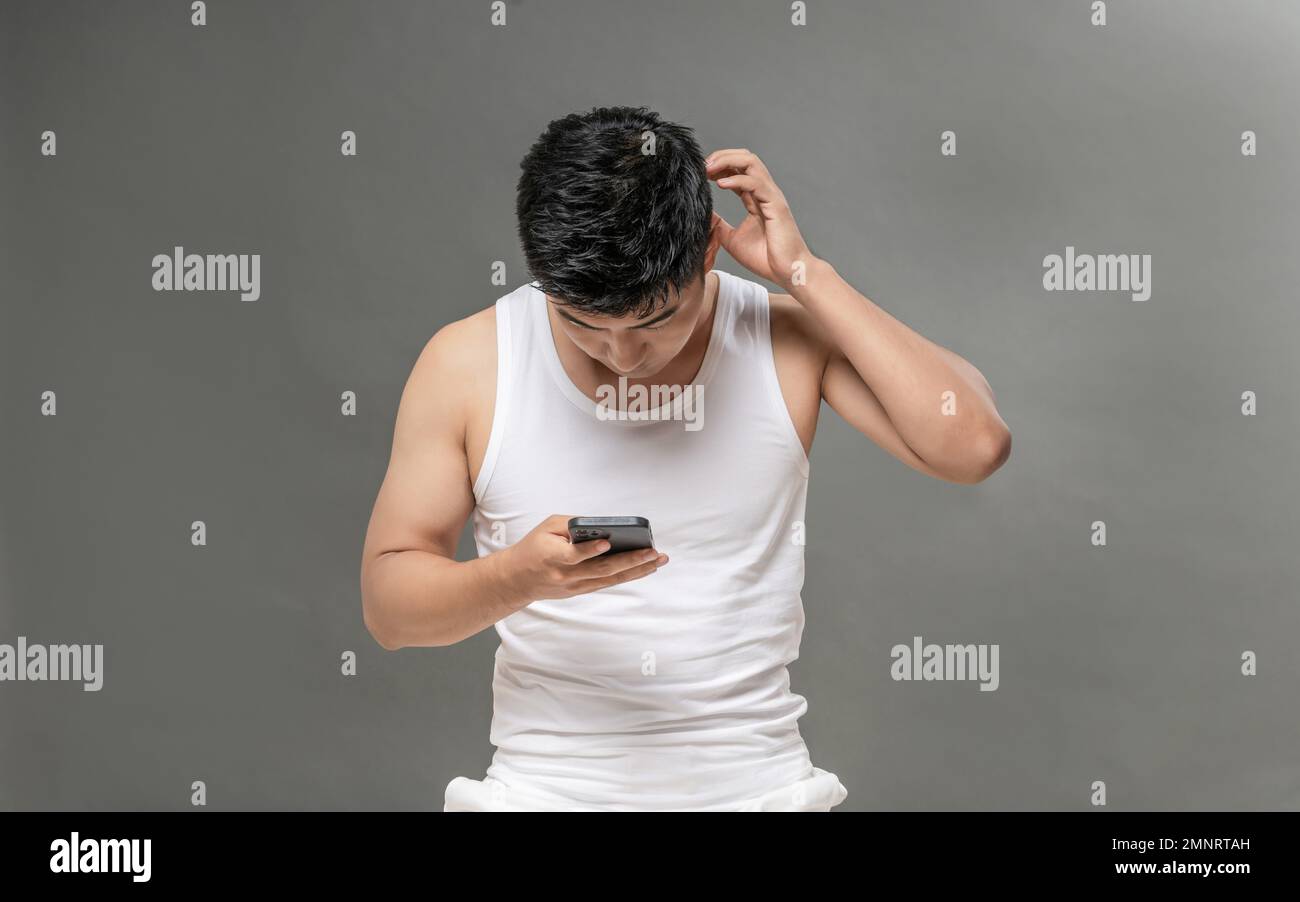 Young men who use mobile phones Stock Photo - Alamy