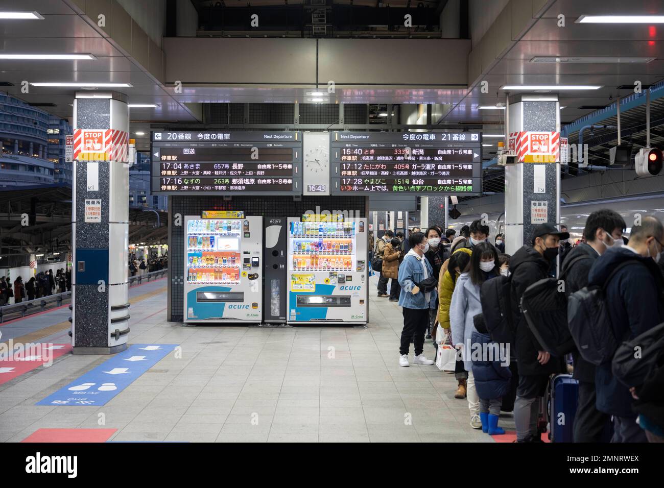 Tokyo, Japan. 27th Jan, 2023. Passengers queue in line for a delayed ...