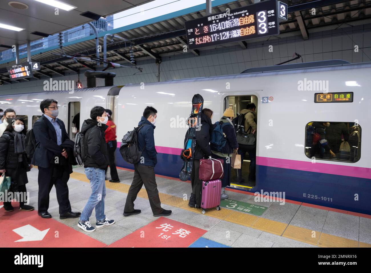 Tokyo, Japan. 27th Jan, 2023. Passengers queue in line for a delayed ...