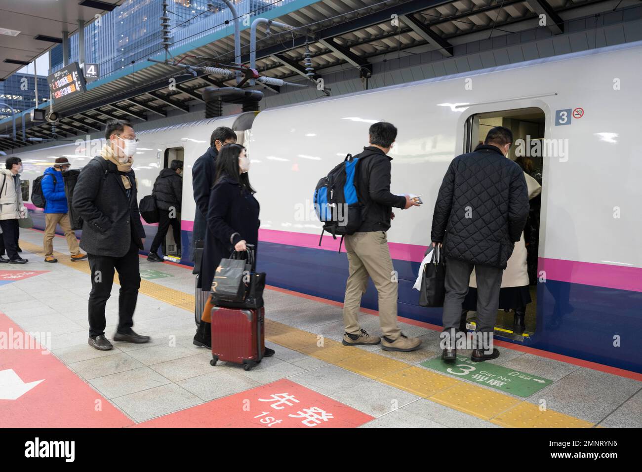 Tokyo, Japan. 27th Jan, 2023. Passengers queue in line for a delayed ...