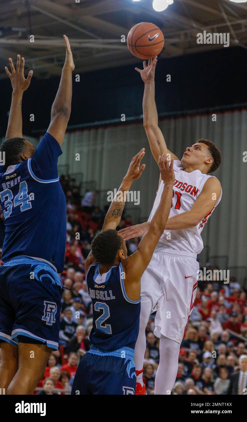 Davidson guard Kellan Grady, right, shoots over Rhode Island guard ...