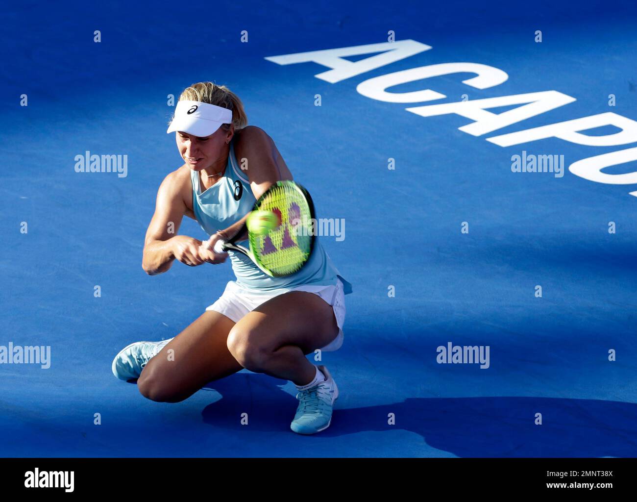 Australia's Daria Gavrilova gets low to return a ball by Ukraine's ...
