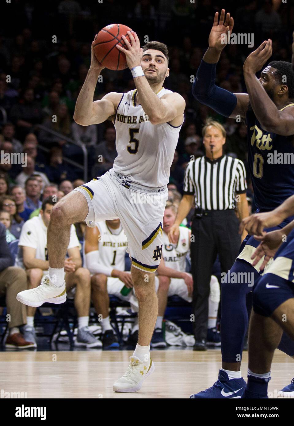 Notre Dame's Matt Farrell (5) goes up for a shot next to Pittsburgh's ...