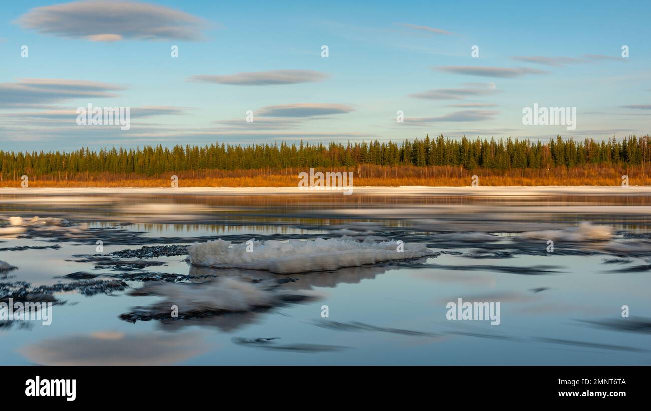 The remains of the last spring ice on the Vilyui River in Yakutia float ...
