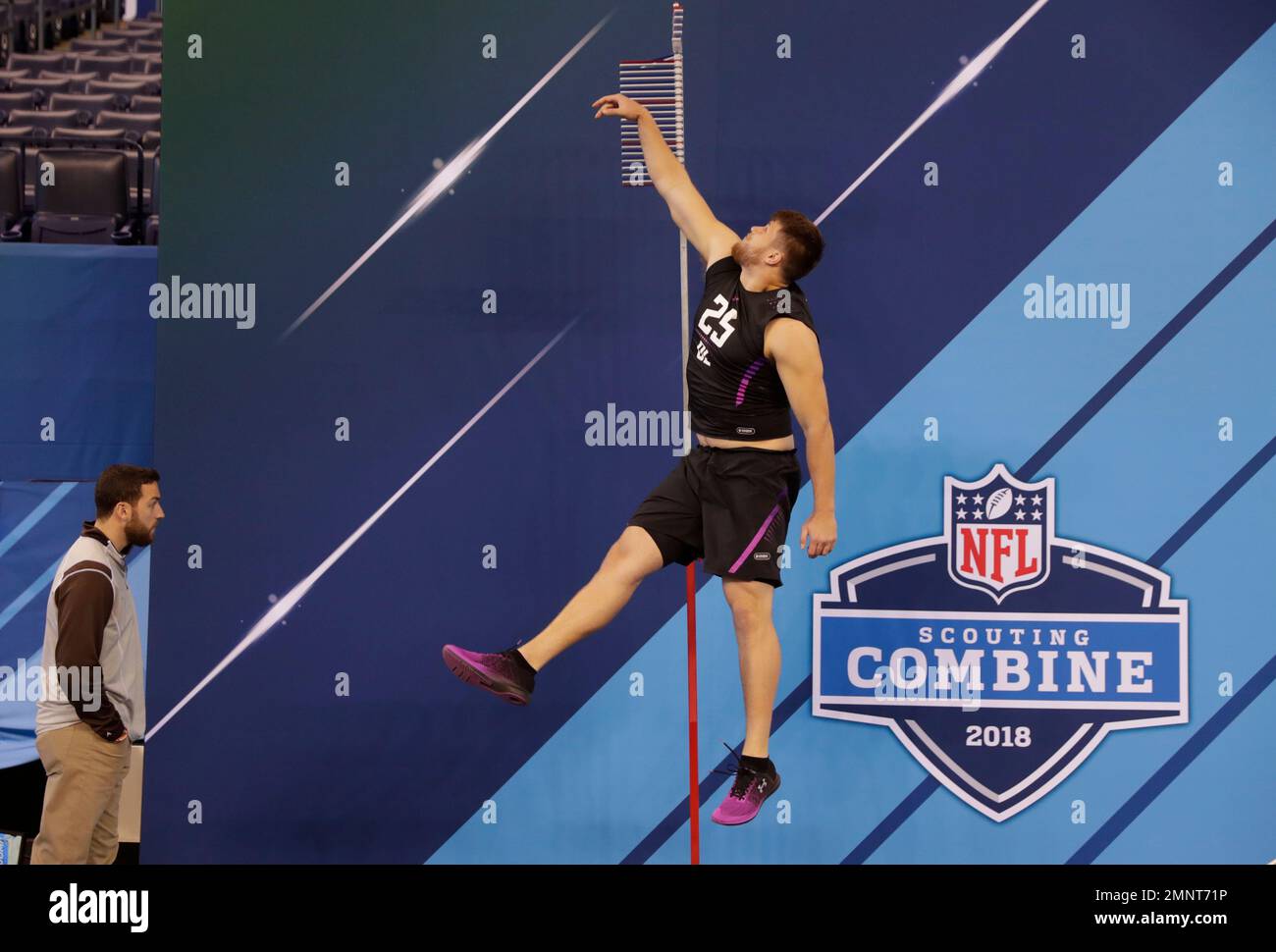 UCLA offensive lineman Kolton Miller runs a drill at the NFL football ...