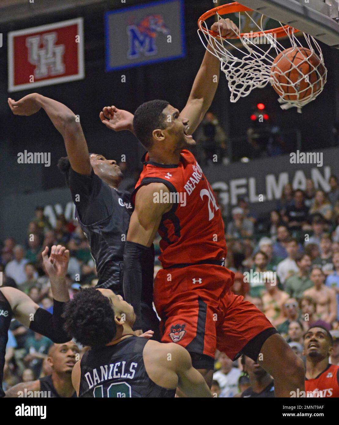 Cincinnati forward, Kyle Washington, right, dunks the ball against ...