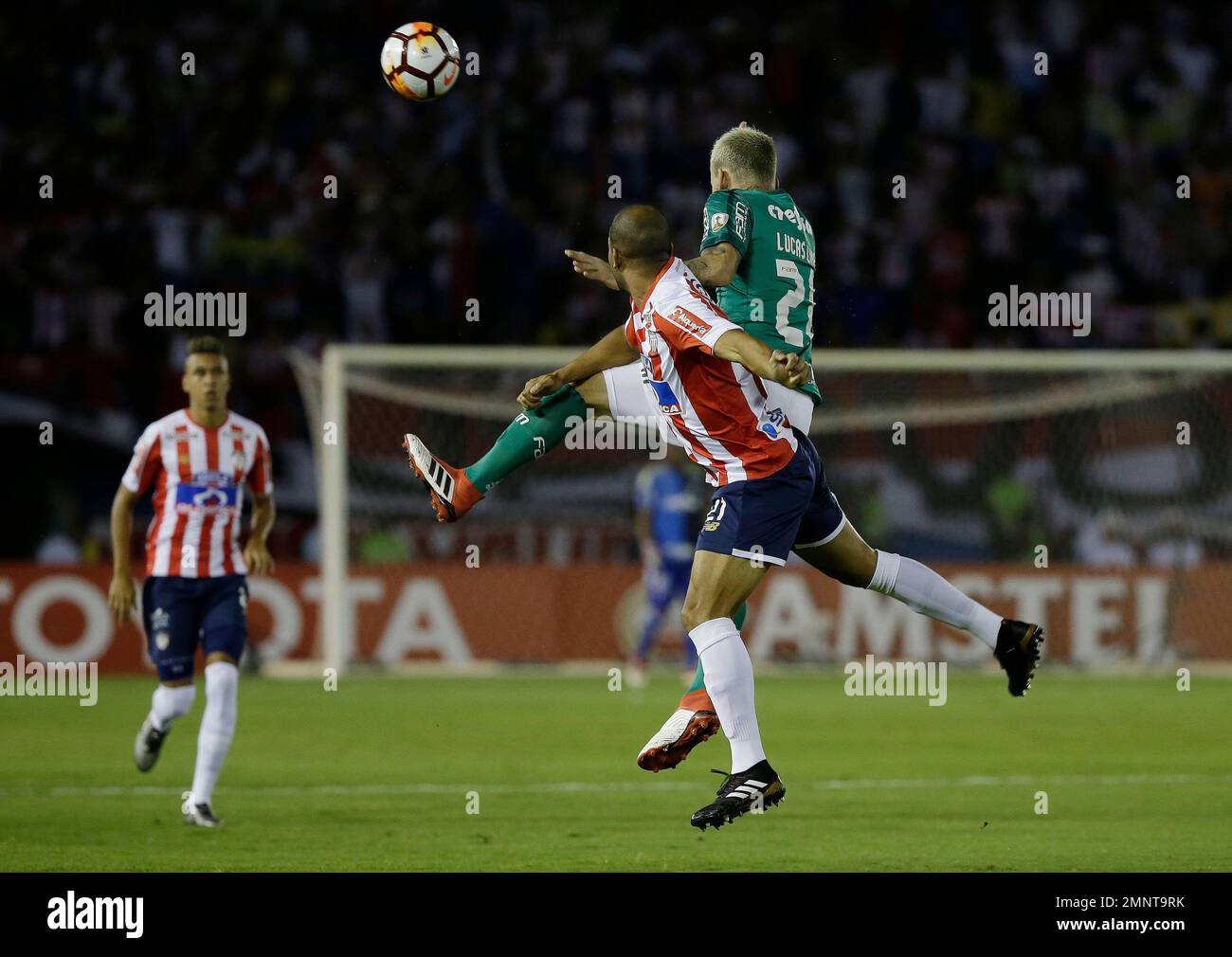 Marlon Piedrahita of Colombia's Junior, second right, jumps for a ...