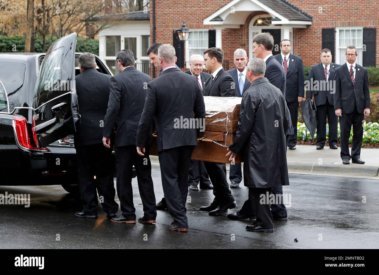 Pallbearers carry the casket of the Rev. Billy Graham as it returns to ...