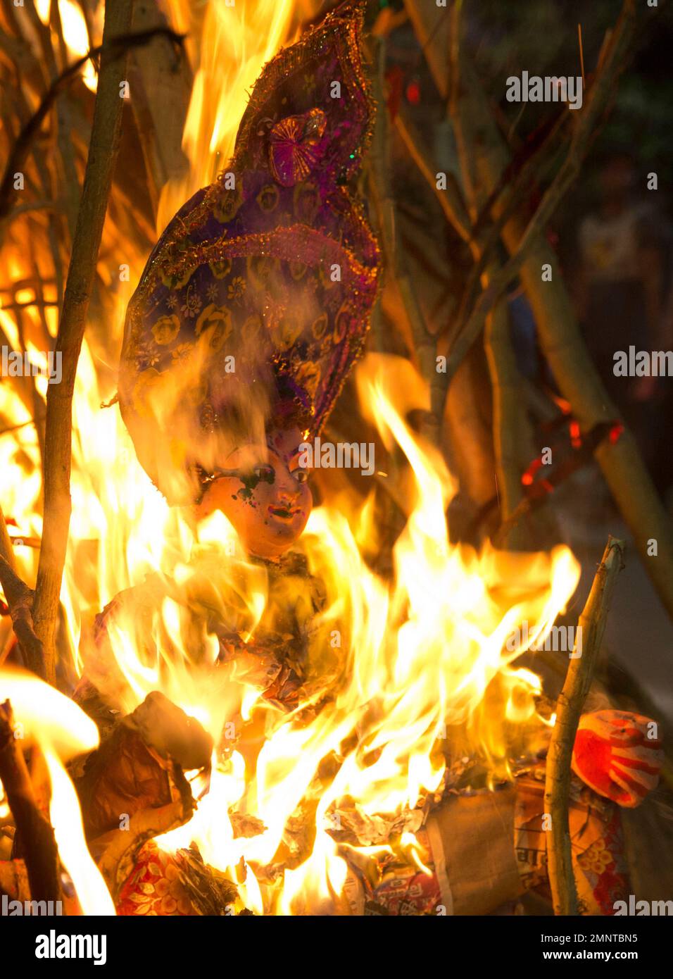 Hindu deity Holika Devi in a bonfire during Holi festival celebrations ...