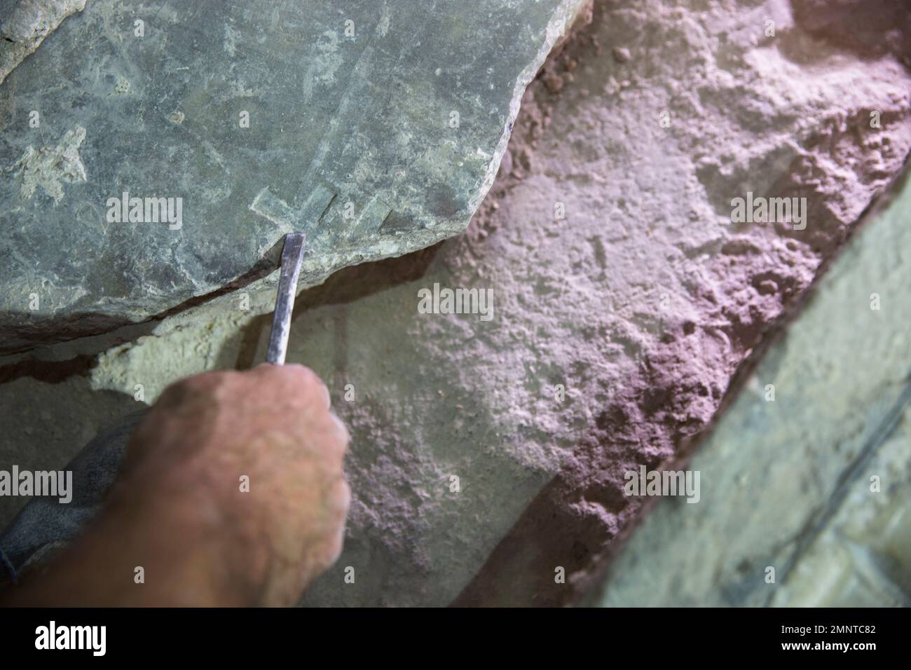 In this Friday, Oct. 28, 2016 photo, a restorer removes debris beneath ...
