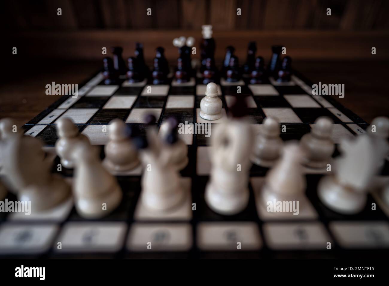 Blurred background with a low depth of focus. The set of wooden chess ...