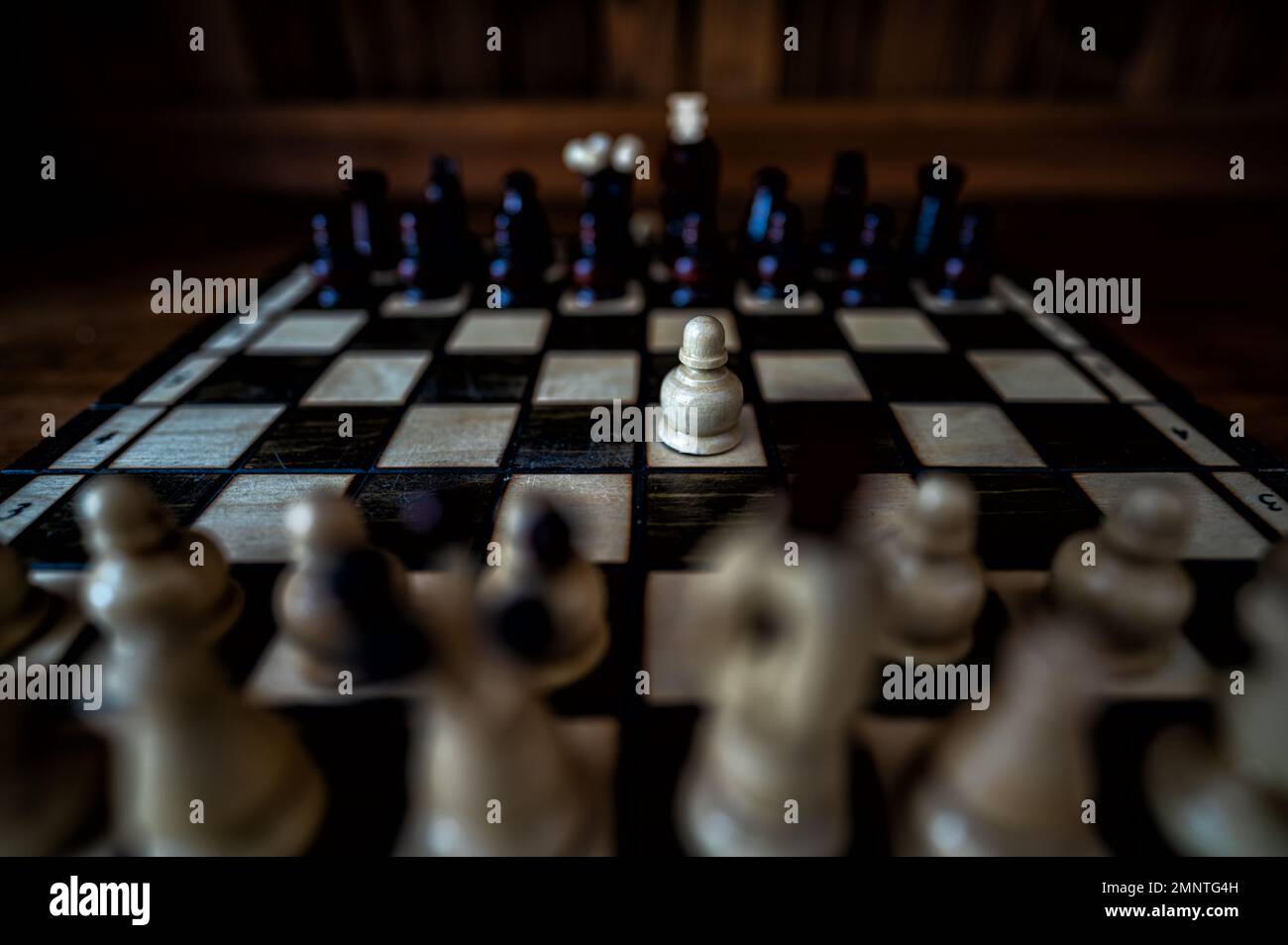 Blurred background with a low depth of focus. The set of wooden chess ...