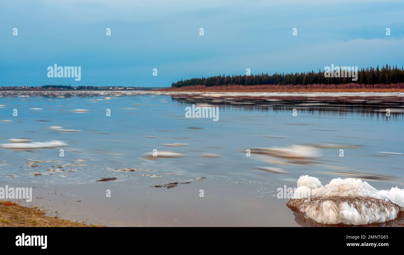 The remains of the last spring ice on the Vilyui River in Yakutia float ...