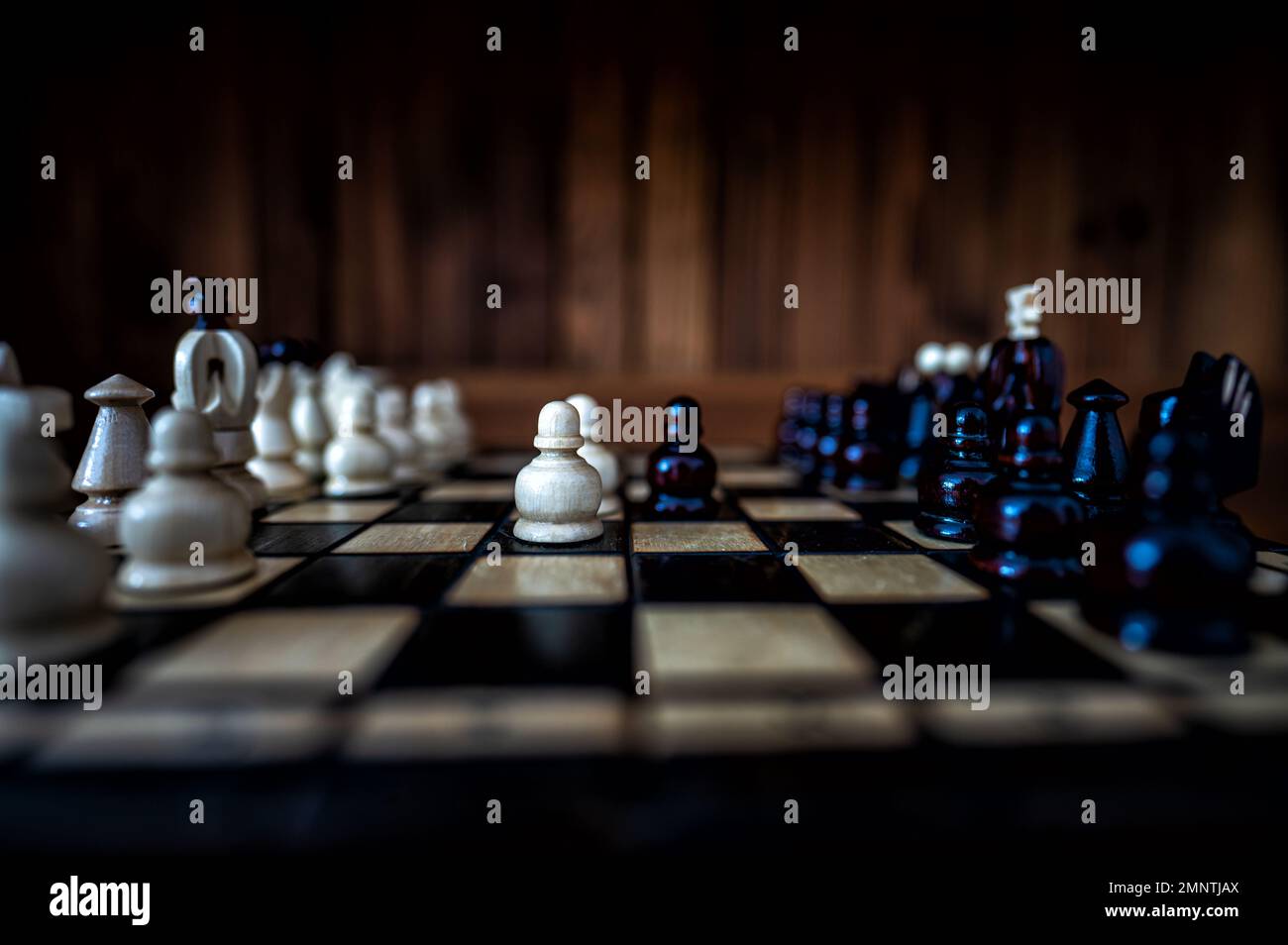 Blurred background with a low depth of focus. The set of wooden chess ...