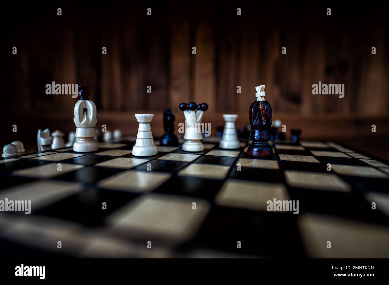 Blurred background with a low depth of focus. The set of wooden chess ...