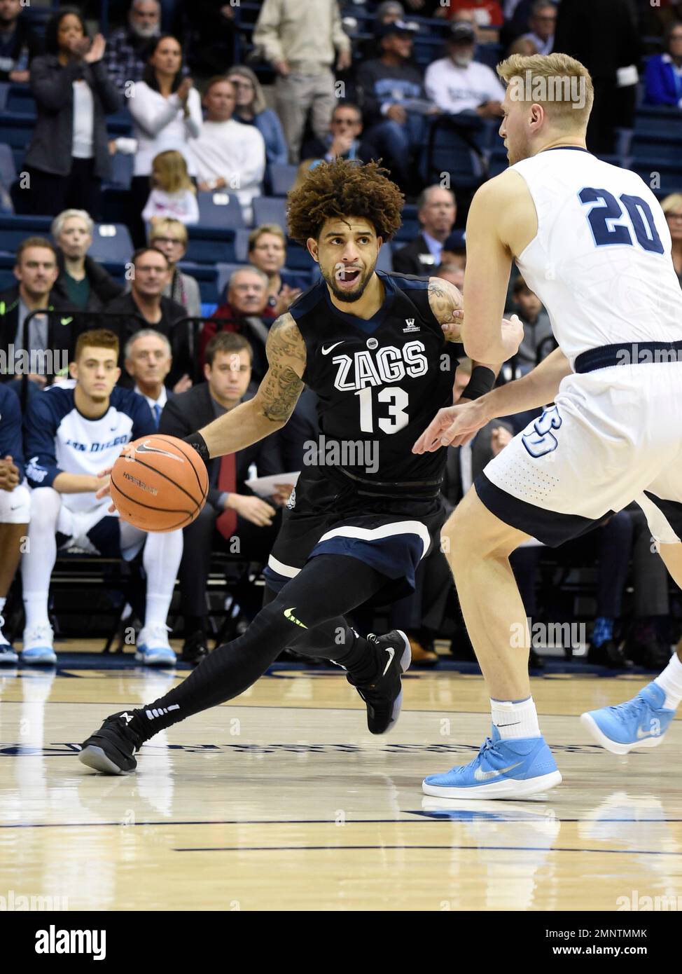 Gonzaga guard Josh Perkins (13) drives past San Diego forward Cameron ...