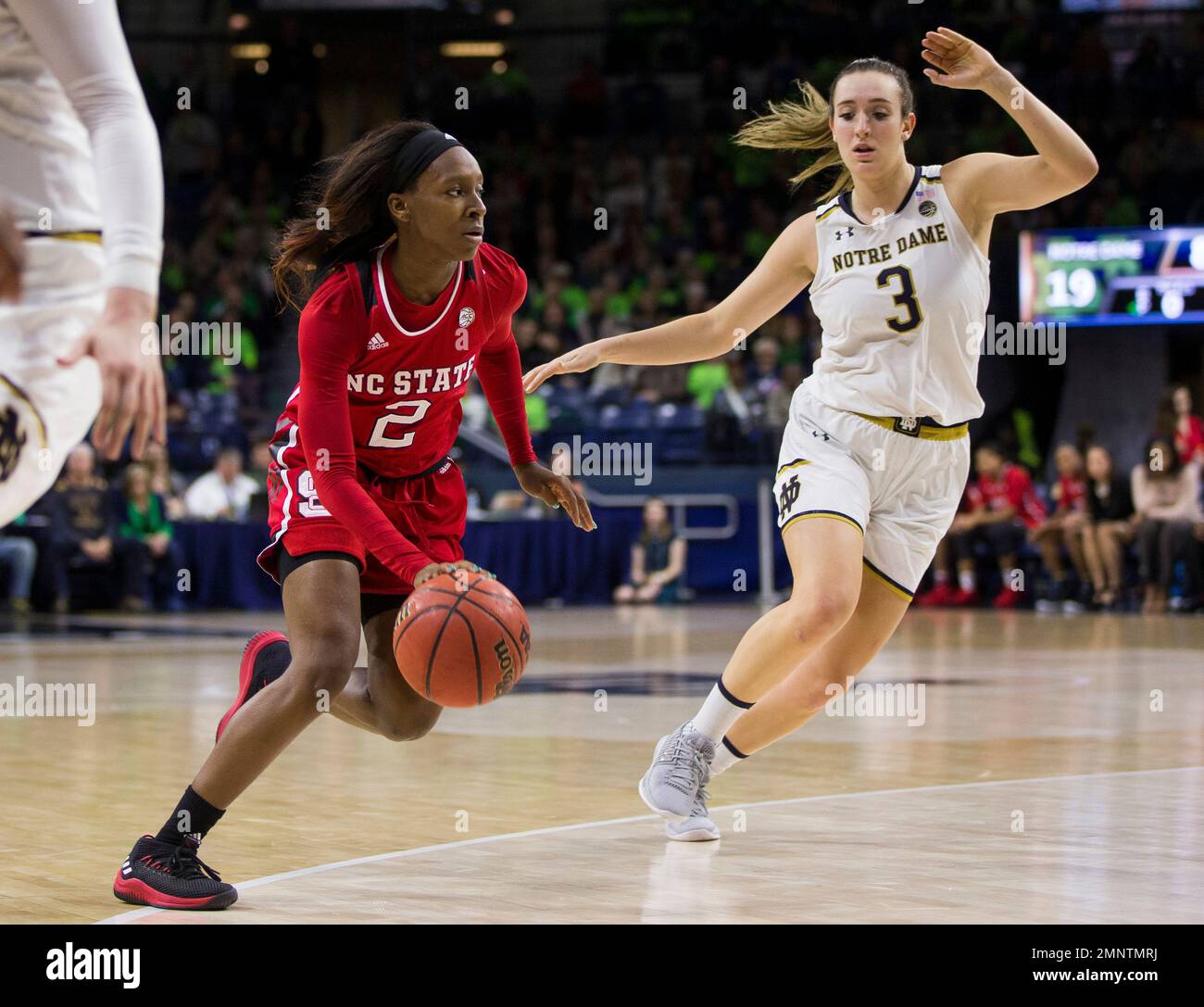 North Carolina State's KailaEaley (2) drives in next to Notre Dame's ...