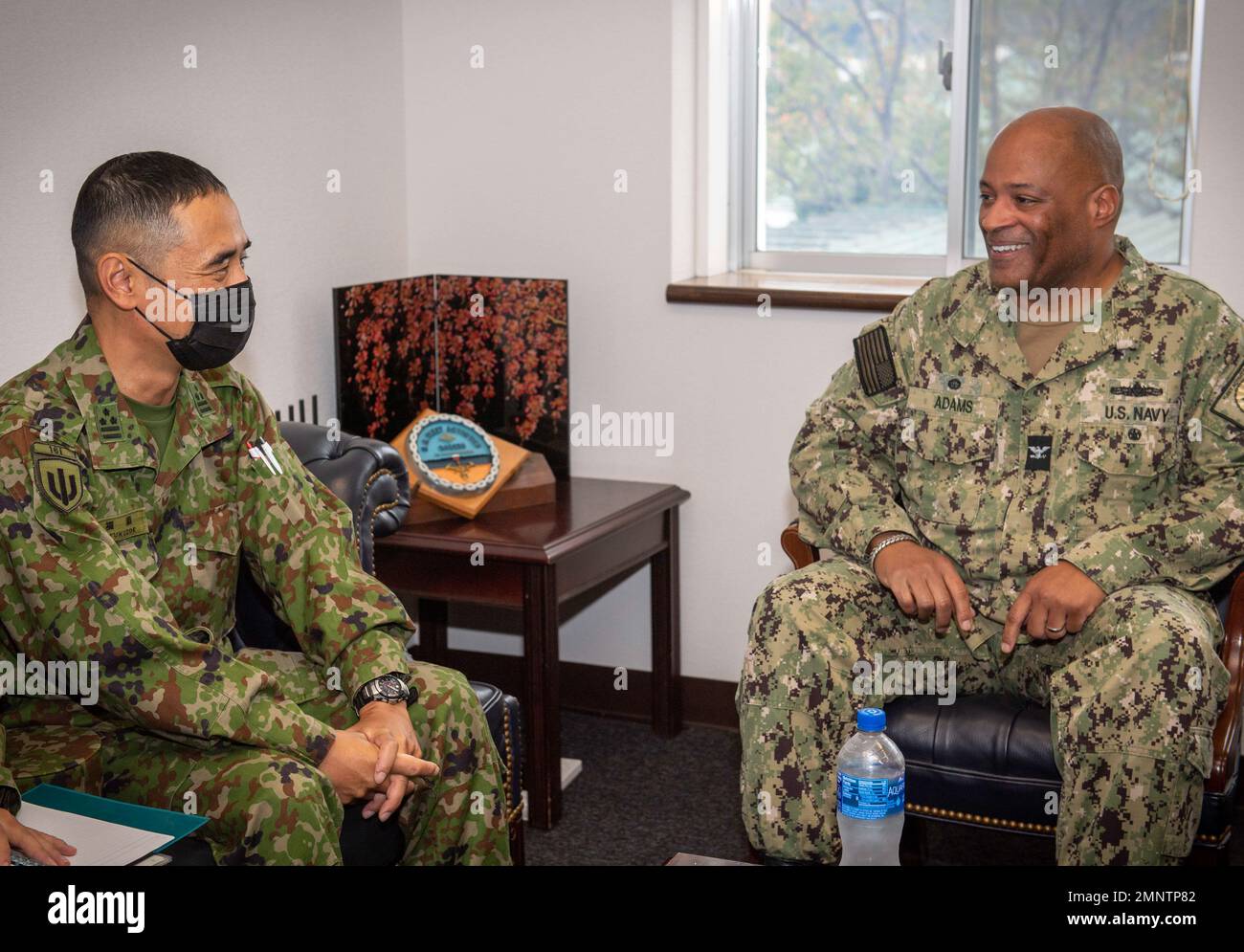Capt. David Adams, Commander, Fleet Activities Sasebo (CFAS), speaks to ...