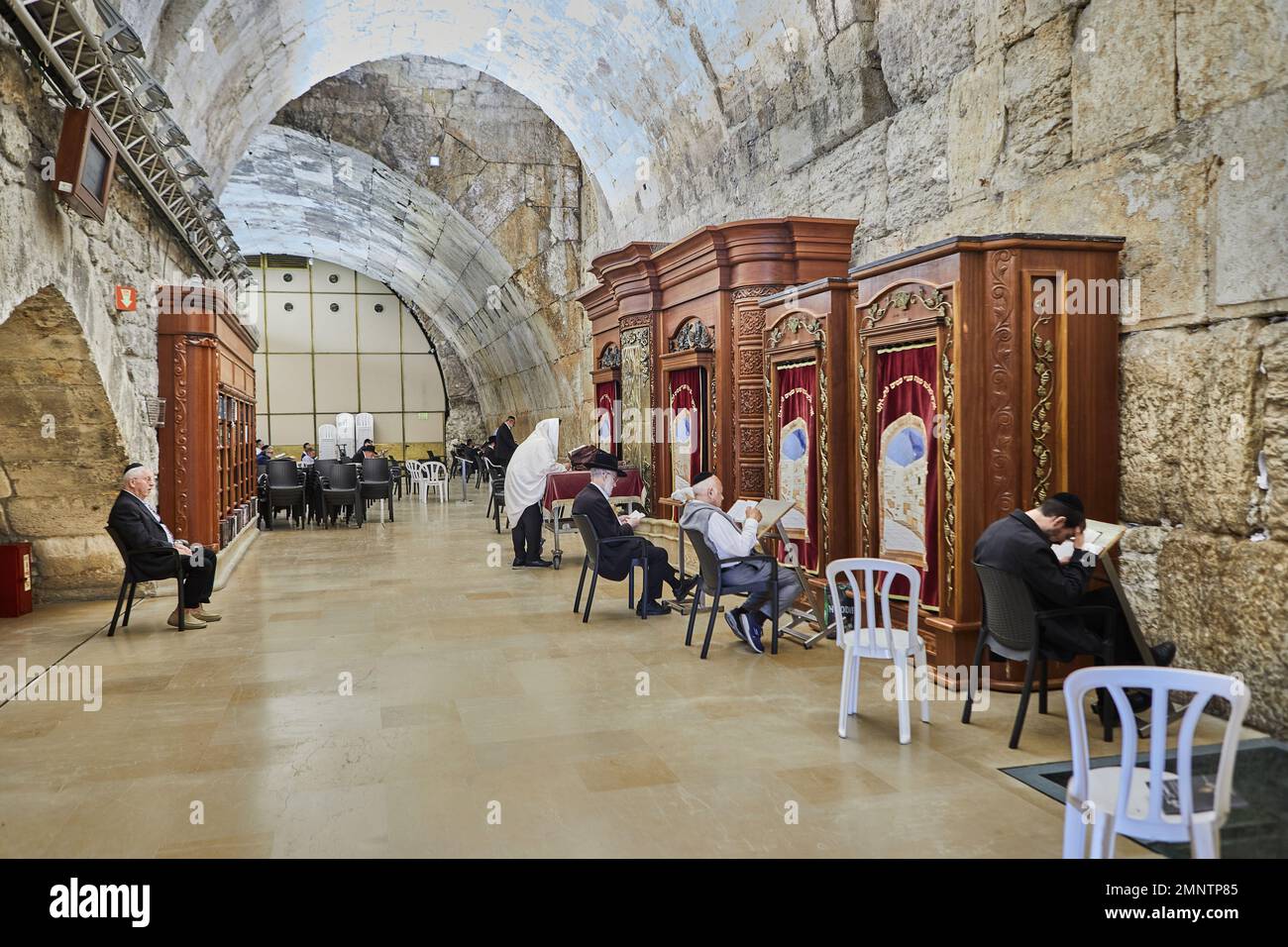 Room for prayers. To the left of the Wailing Wall with the saints is ...