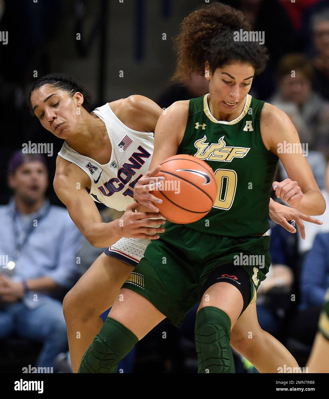 Connecticut's Gabby Williams, left, pressures South Florida's Laura ...