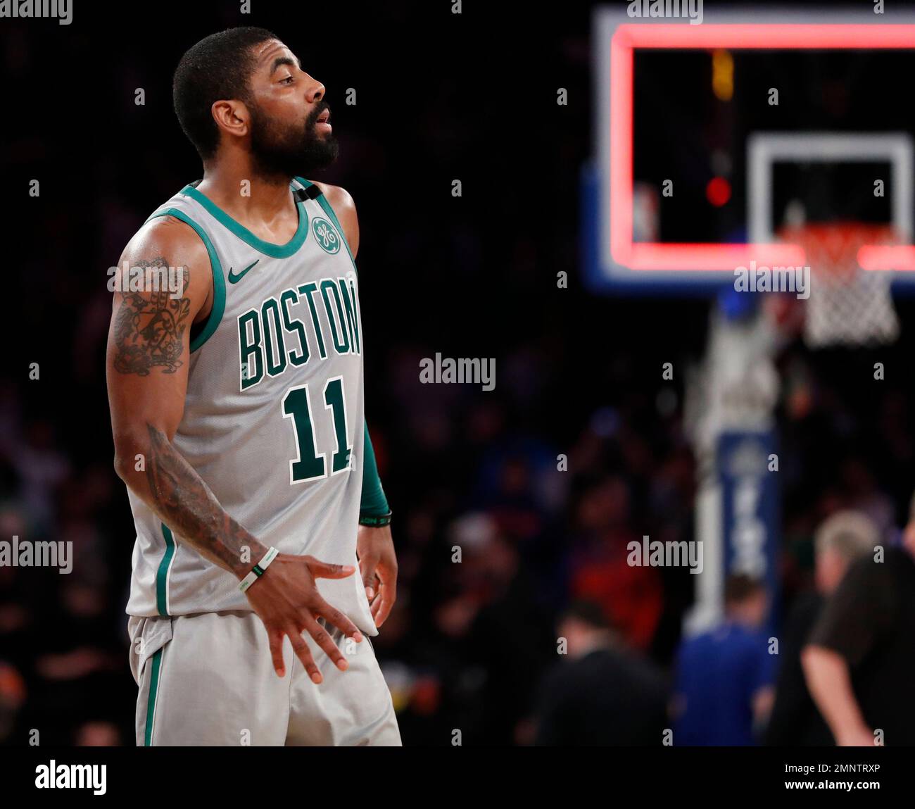 Boston Celtics guard Kyrie Irving (11) looks toward the bench during a ...