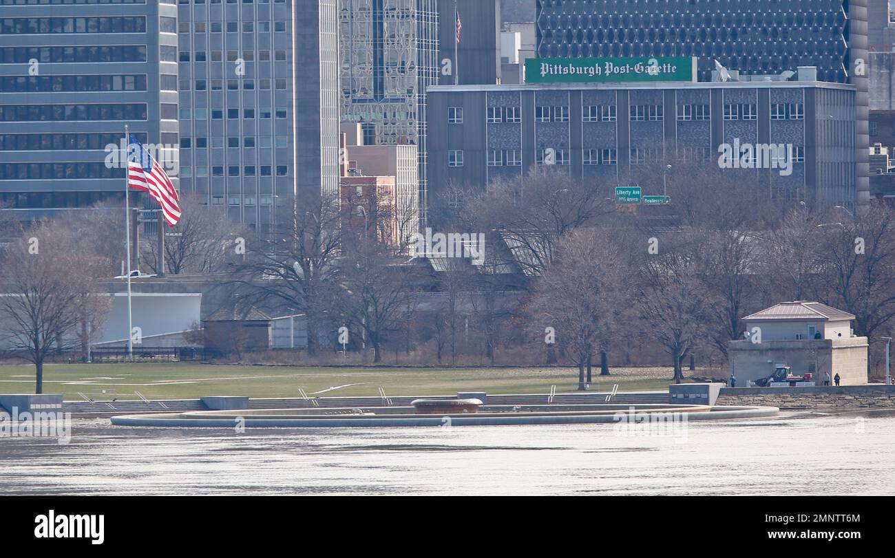 High water from the flooded Ohio River covers the walkways around the ...