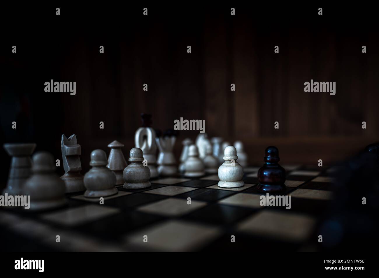 Blurred background with a low depth of focus. The set of wooden chess ...