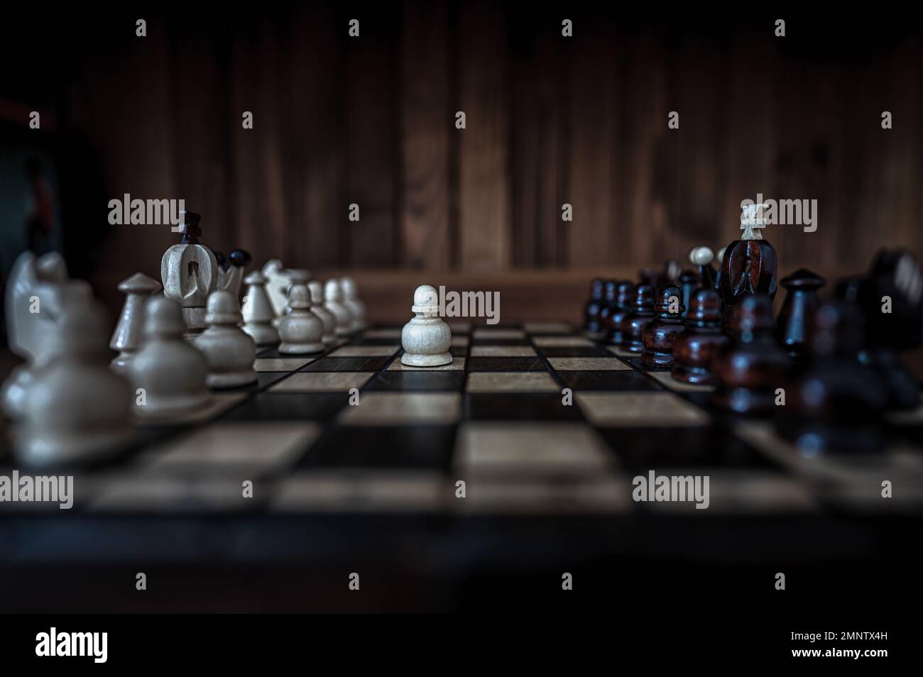 Blurred background with a low depth of focus. The set of wooden chess ...