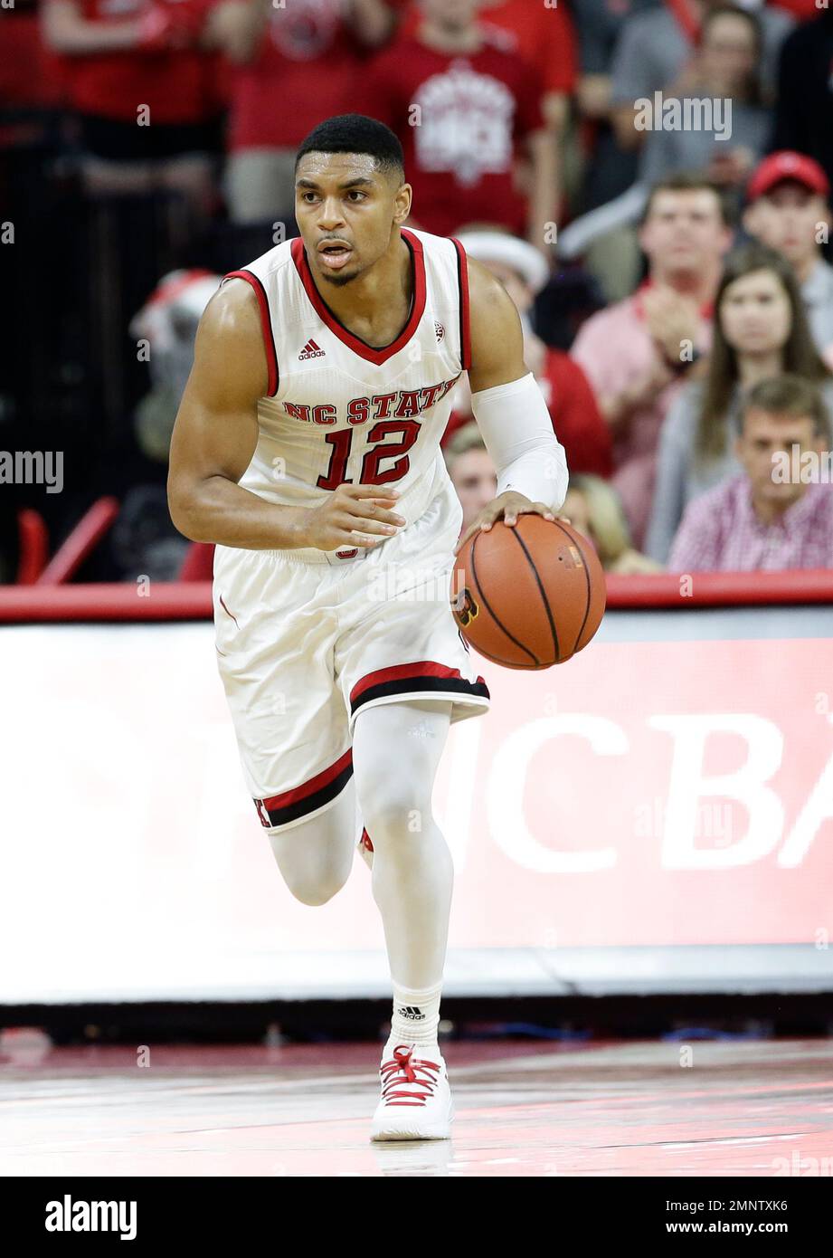 North Carolina State's Allerik Freeman (12) dribbles during the first ...