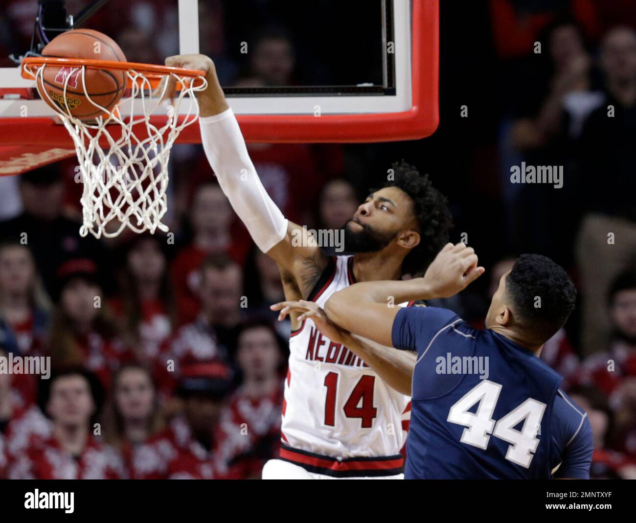 Nebraska's Isaac Copeland (14) dunks over Penn State's Julian Moore (44 ...
