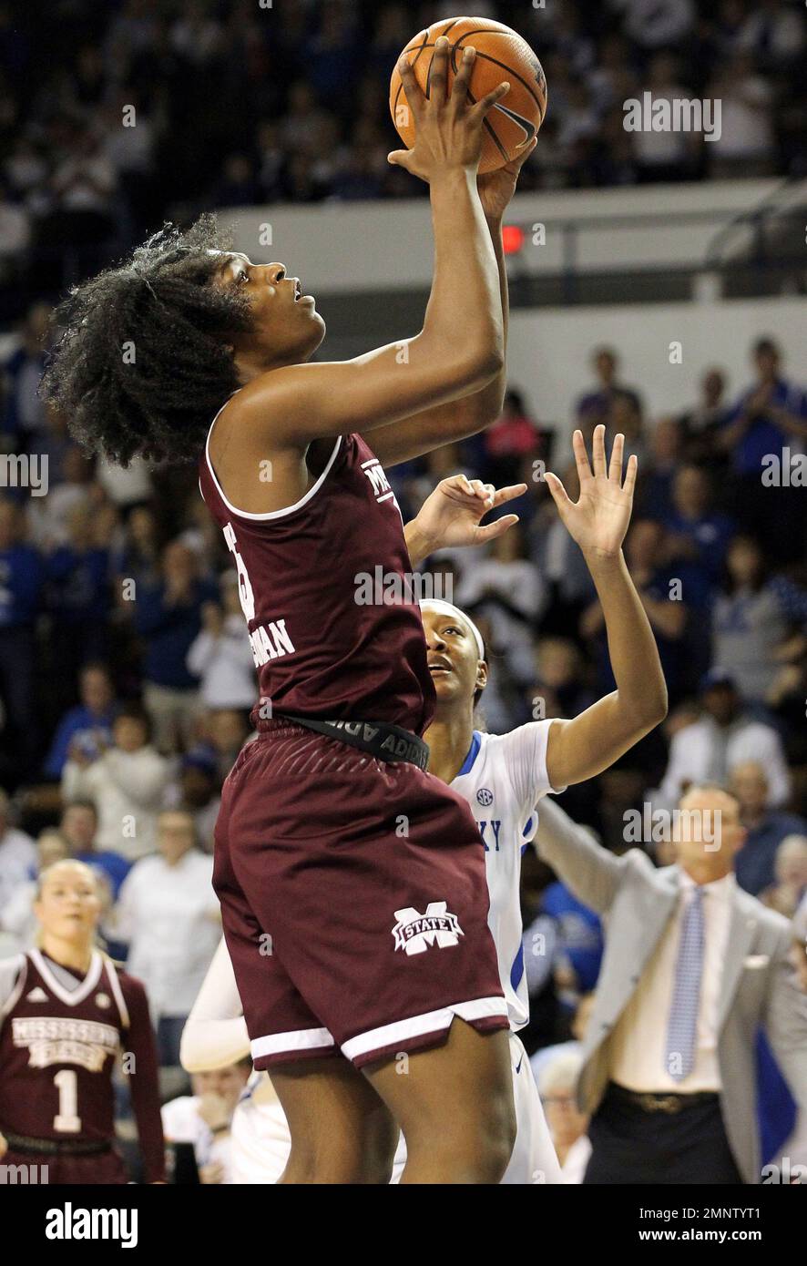 Mississippi State's Teaira McCowan, top, shoots near Kentucky's Tatyana ...