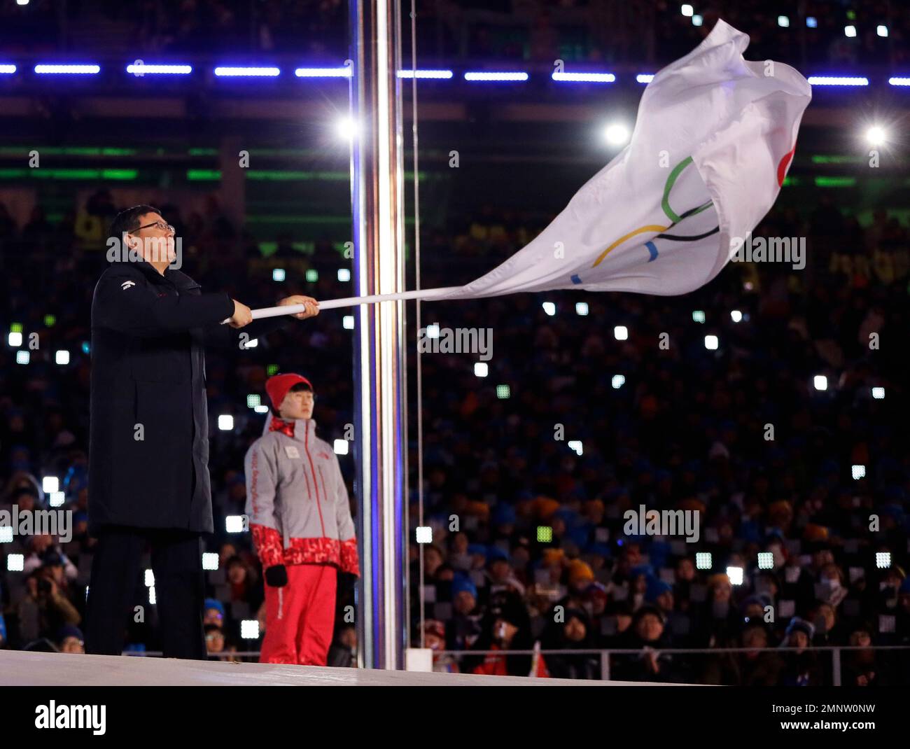 Chen Jining mayor of Beijing waves the Olympic flag during the closing ...