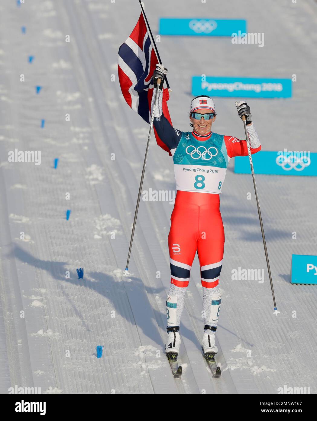 Marit Bjoergen, of Norway, celebrates after winning the gold medal in ...