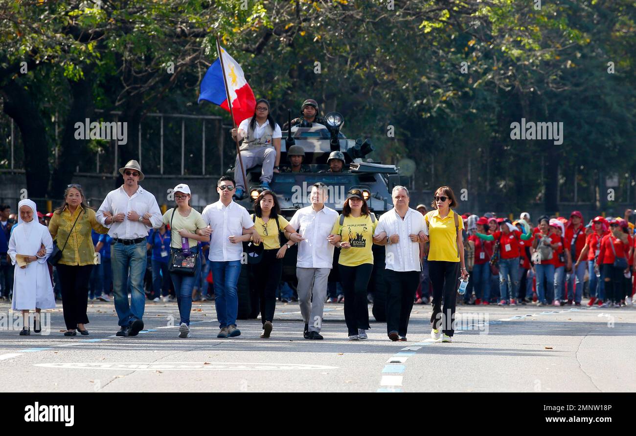 Civil society groups link arms as they take part in celebrations of the ...