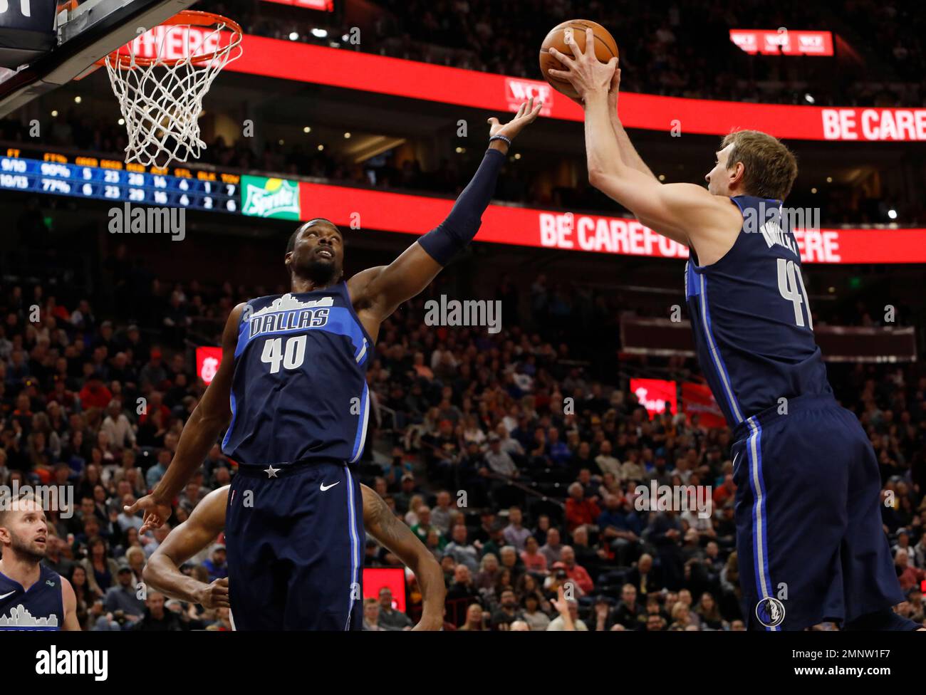 Dallas Mavericks' Harrison Barnes (40) and Dirk Nowitzki (41) rebound ...