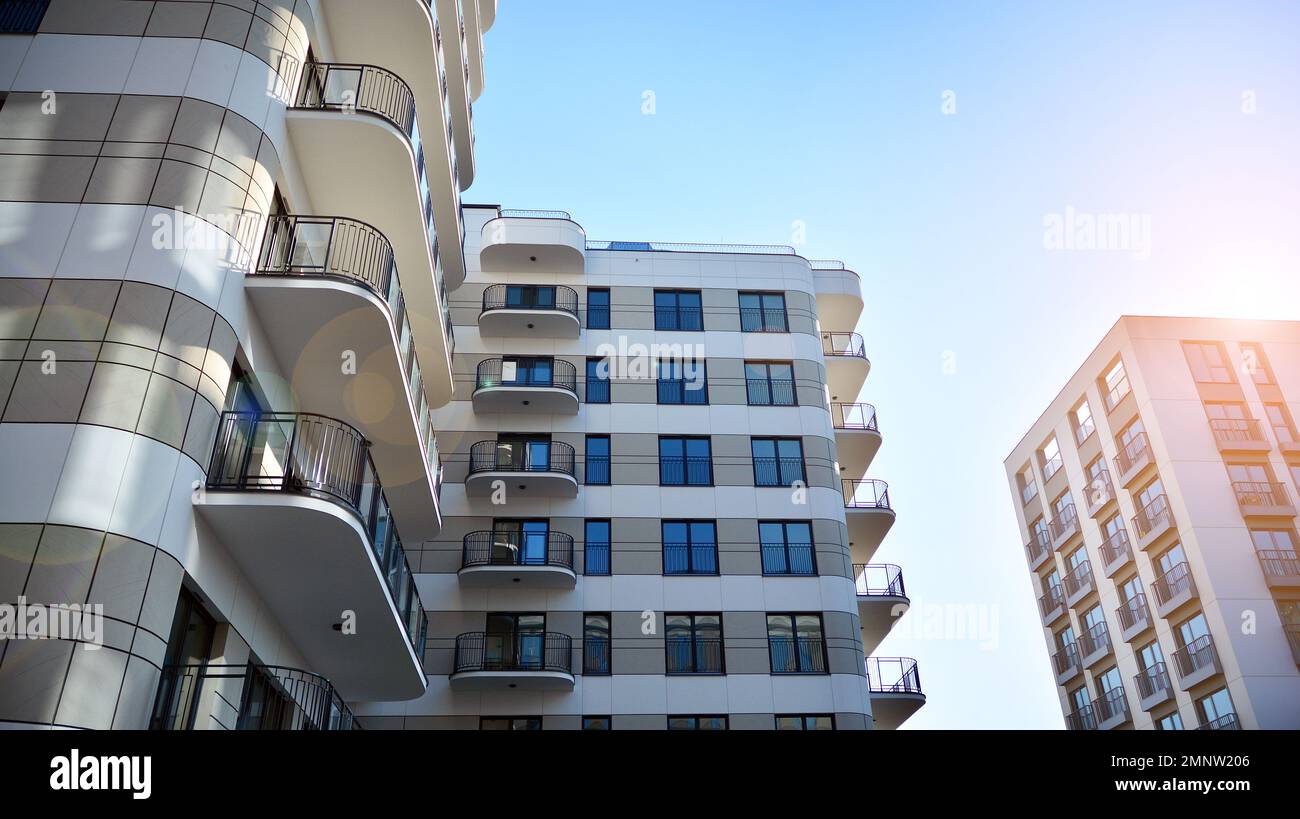 Futuristic square architecture of apartment building. Real estate with ...