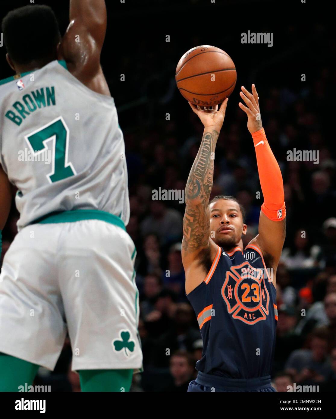 New York Knicks guard Trey Burke (23) shoots a three-point shot with ...