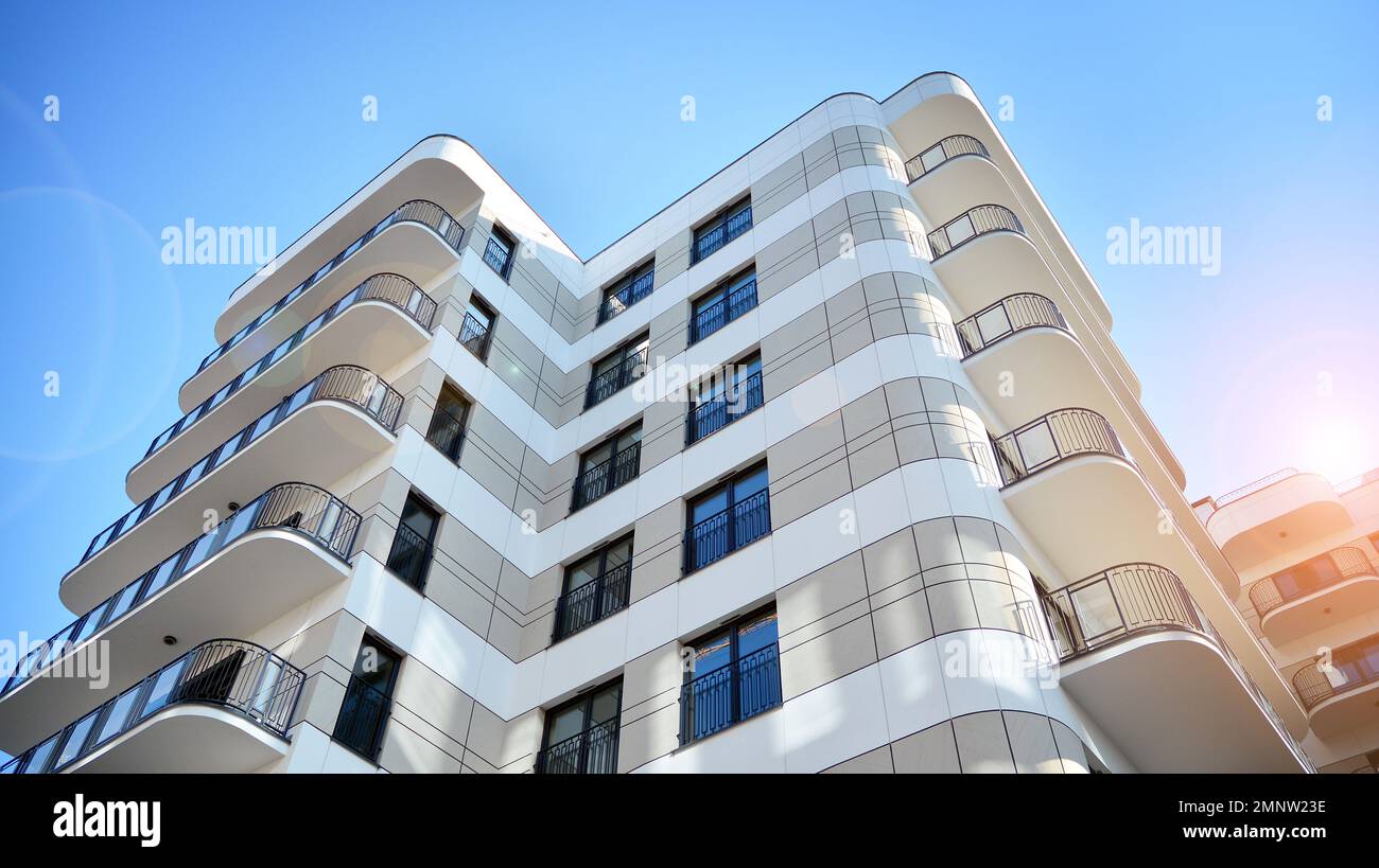 Futuristic square architecture of apartment building. Real estate with ...